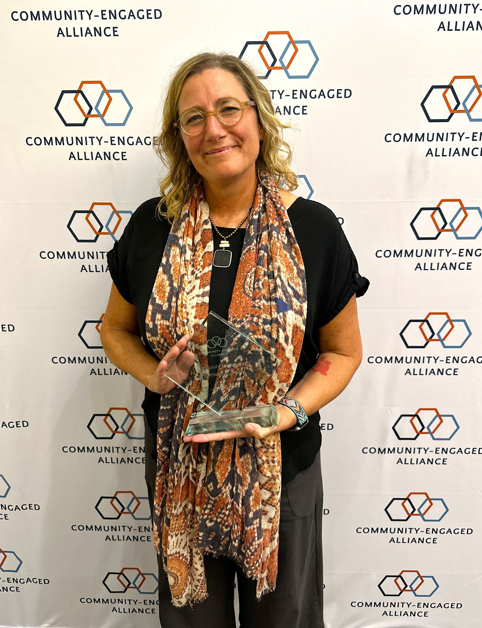 Kelli Huth receives two community engagement awards - Office of ...